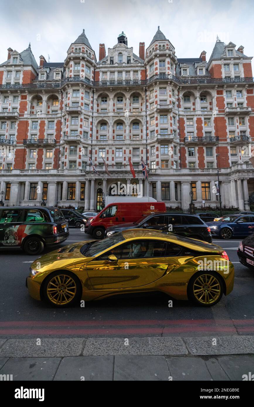 Luxury Gold BMW Coupe car caught up in rush hour traffic along ...