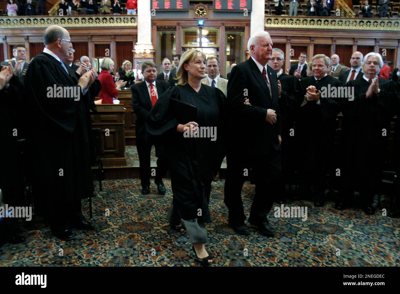 Chief Justice of the Iowa Supreme Court Marsha Ternus is escorted by ...