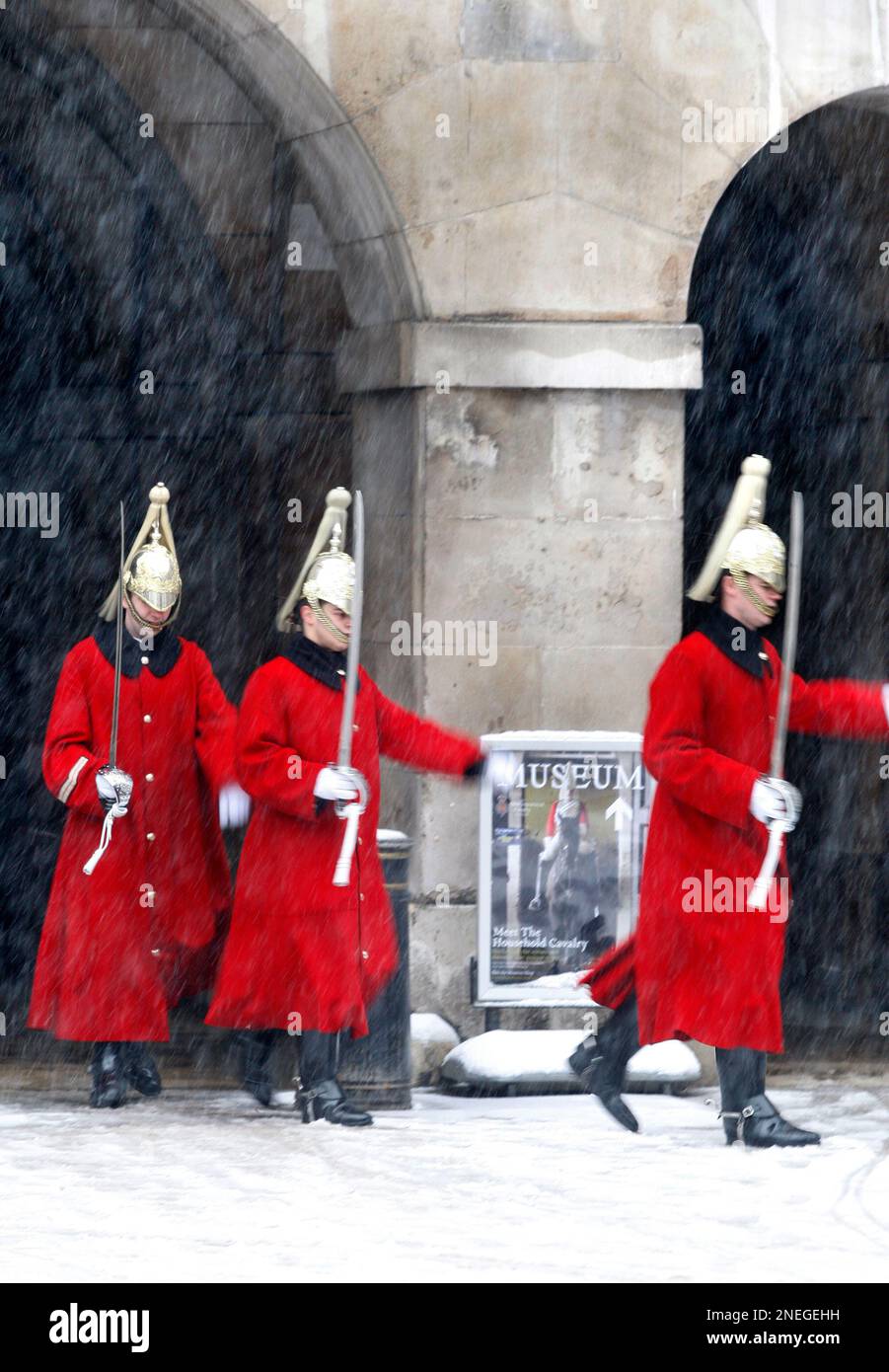 Horse Guards march through the snow at the Horse Guards Parade in ...
