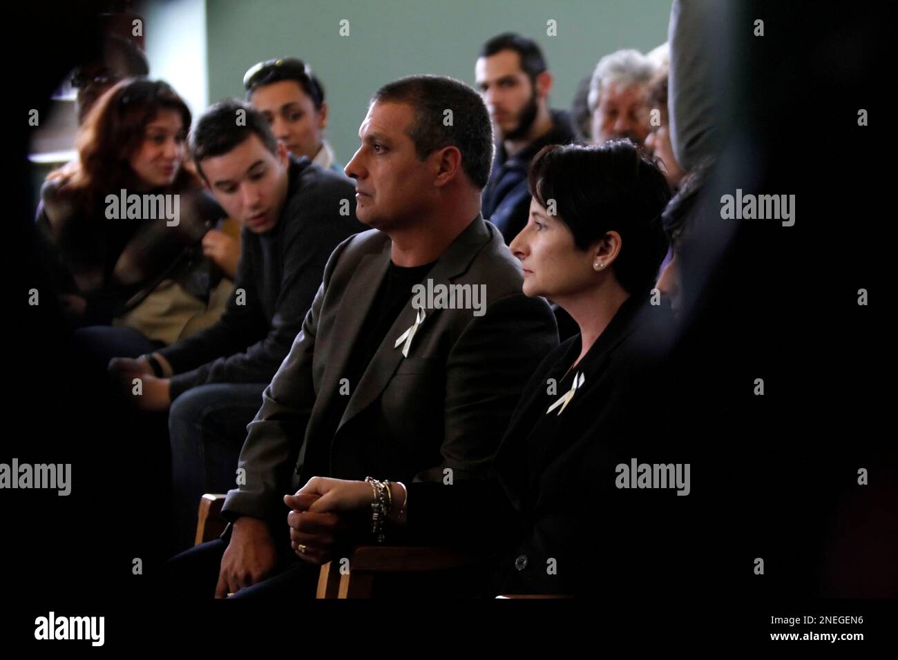Australian Rosemarie Zammit, right, holds the hand of her husband ...