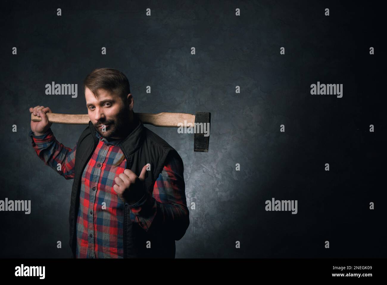 Woodsman with axe. Male strength Stock Photo - Alamy