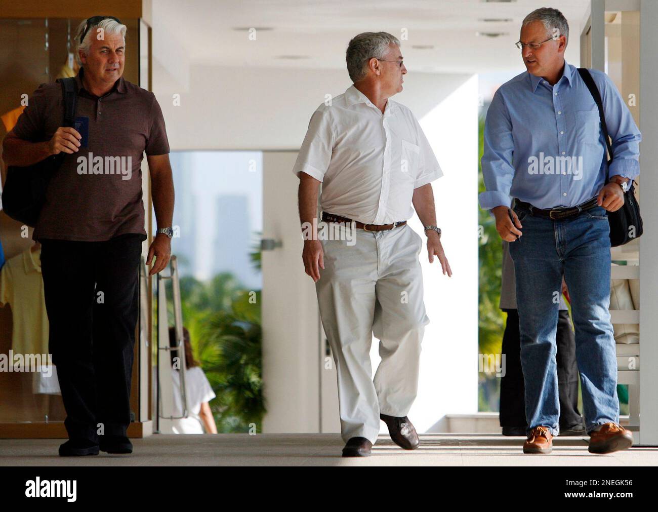 Brad Butterworth, left, CEO and Skipper of Alinghi accompanied by ...