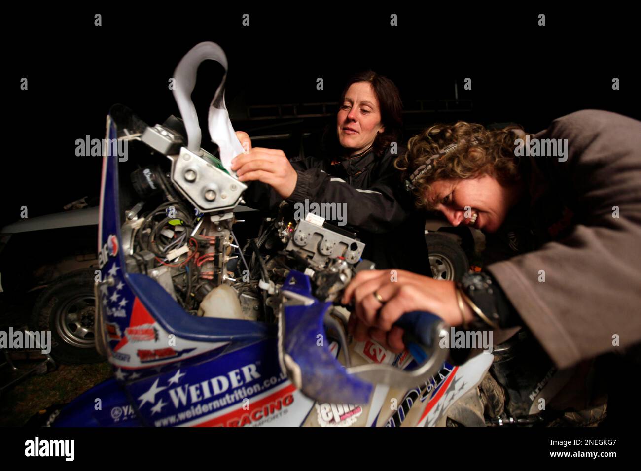 Great Britain's Yamaha's rider Tamsin Jones, left, works with her chief ...