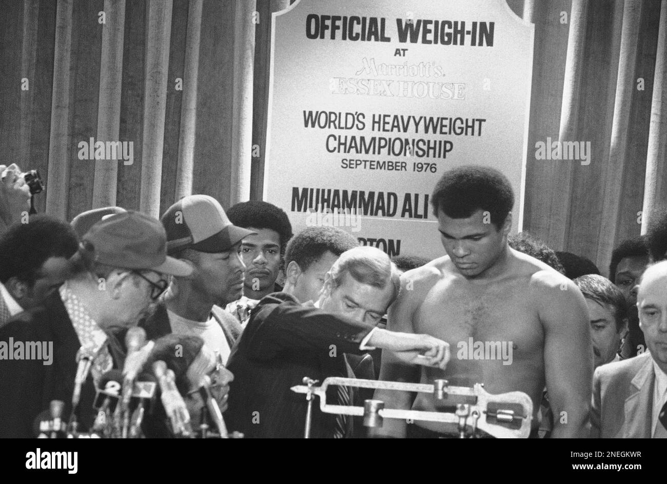 Heavyweight champion Muhammad Ali weighs in at 221 pounds for the ...