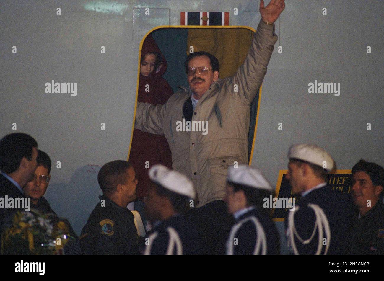 Former U.S. hostage Terry Anderson waves from plane upon arrival, Dec ...