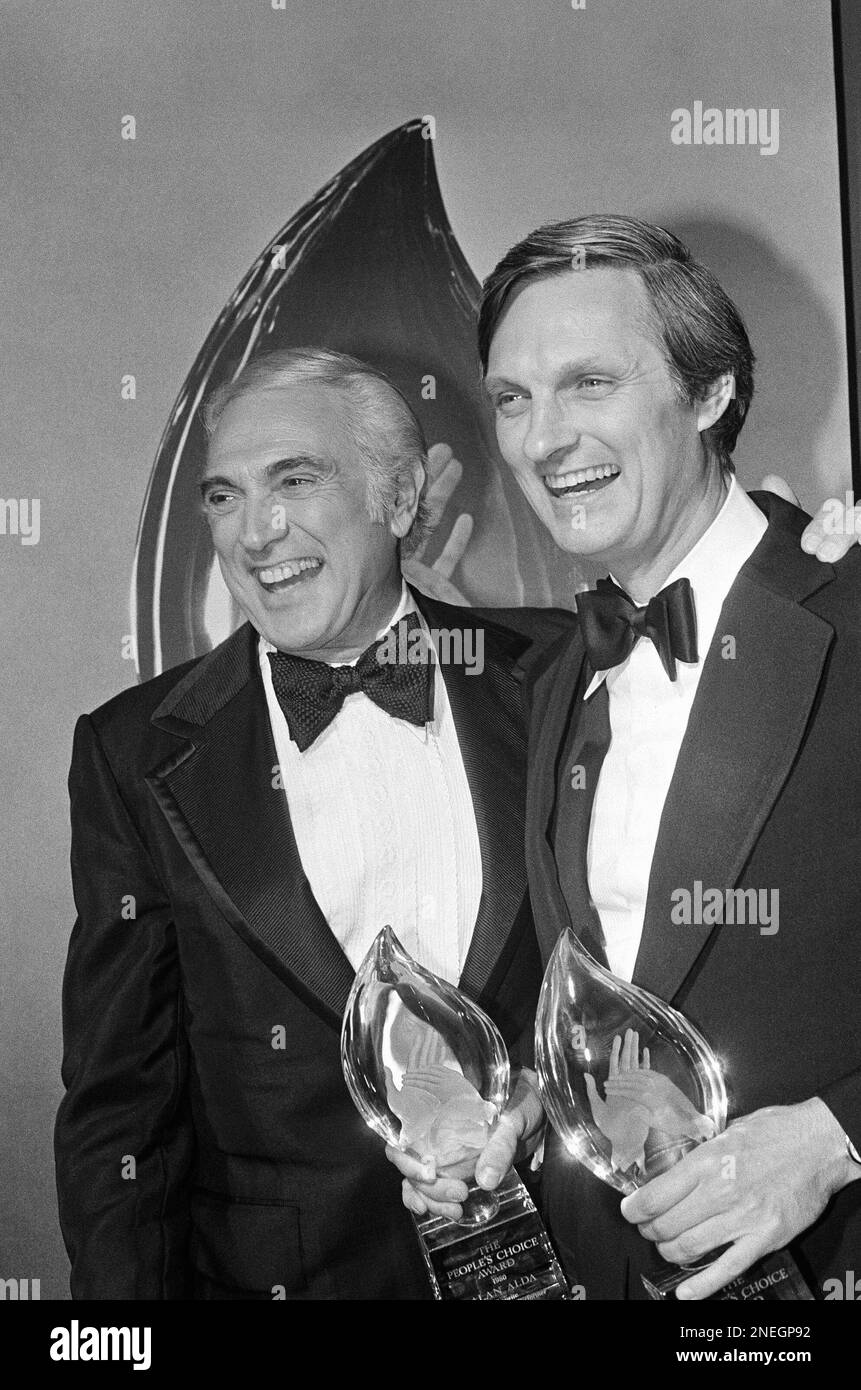 Actor Robert Alda, left, congratulates his son, actor Alan Alda, right ...