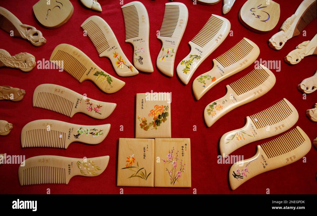 This photo taken Dec. 29, 2009 shows hand-painted wooden combs are ...