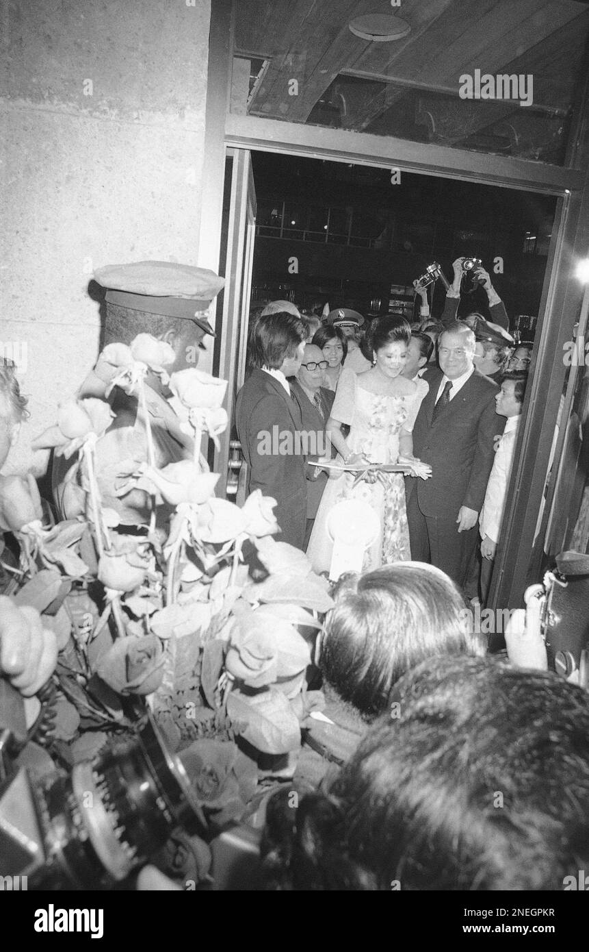 Mrs. Imelda Marcos, Philippine First Lady, cuts ribbon, center ...