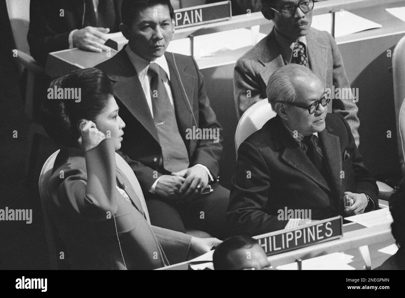 Mrs. Imelda Marcos, wife of Philippines President Marcos, adjusts ...
