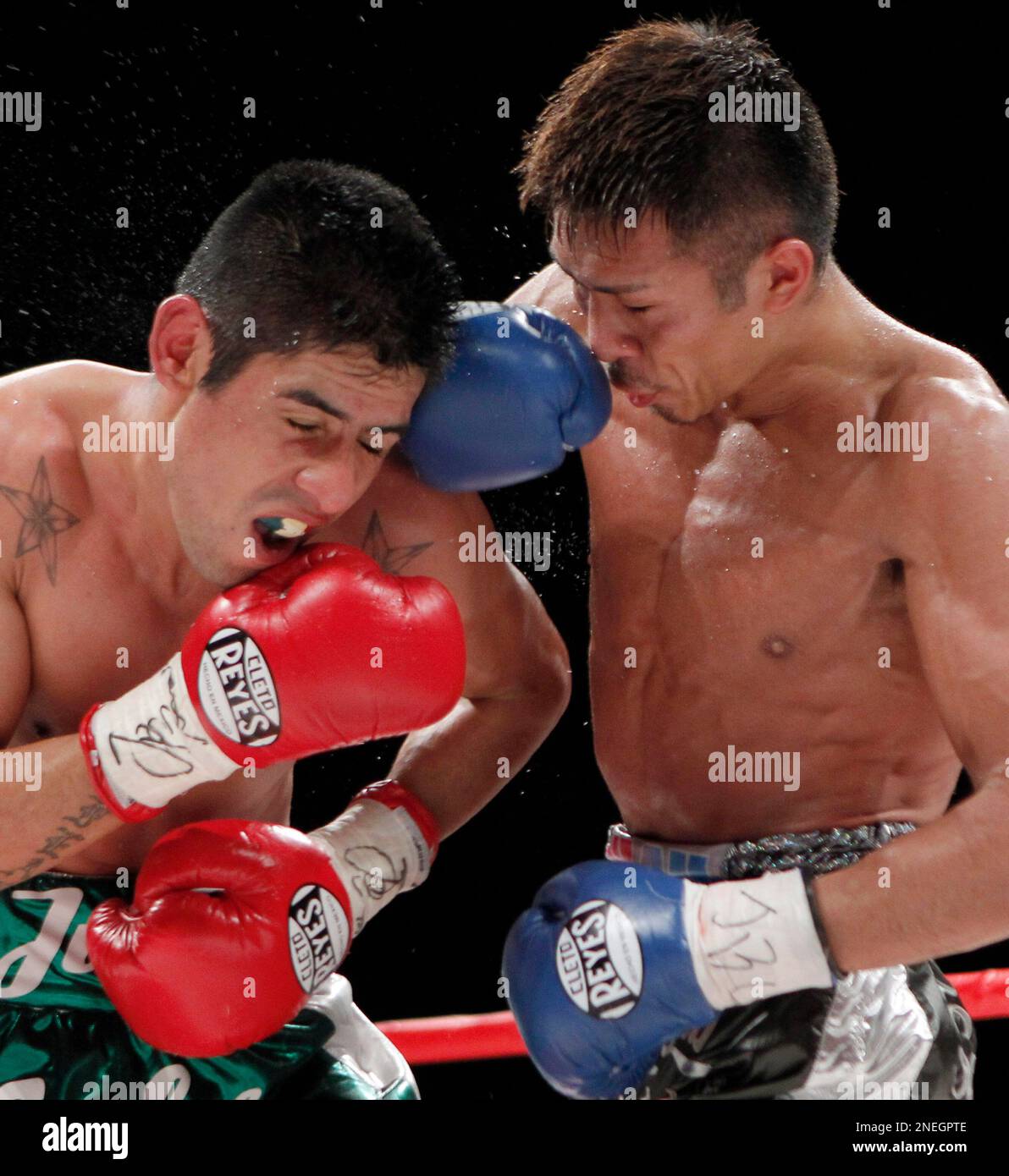 Japanese challenger Takashi Uchiyama, right, fights champion Juan ...