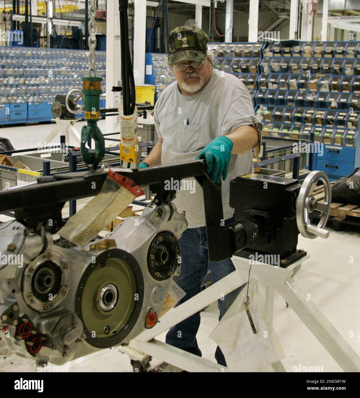 Reg Self works on an airplane engine at the Tinker Aerospace Complex ...