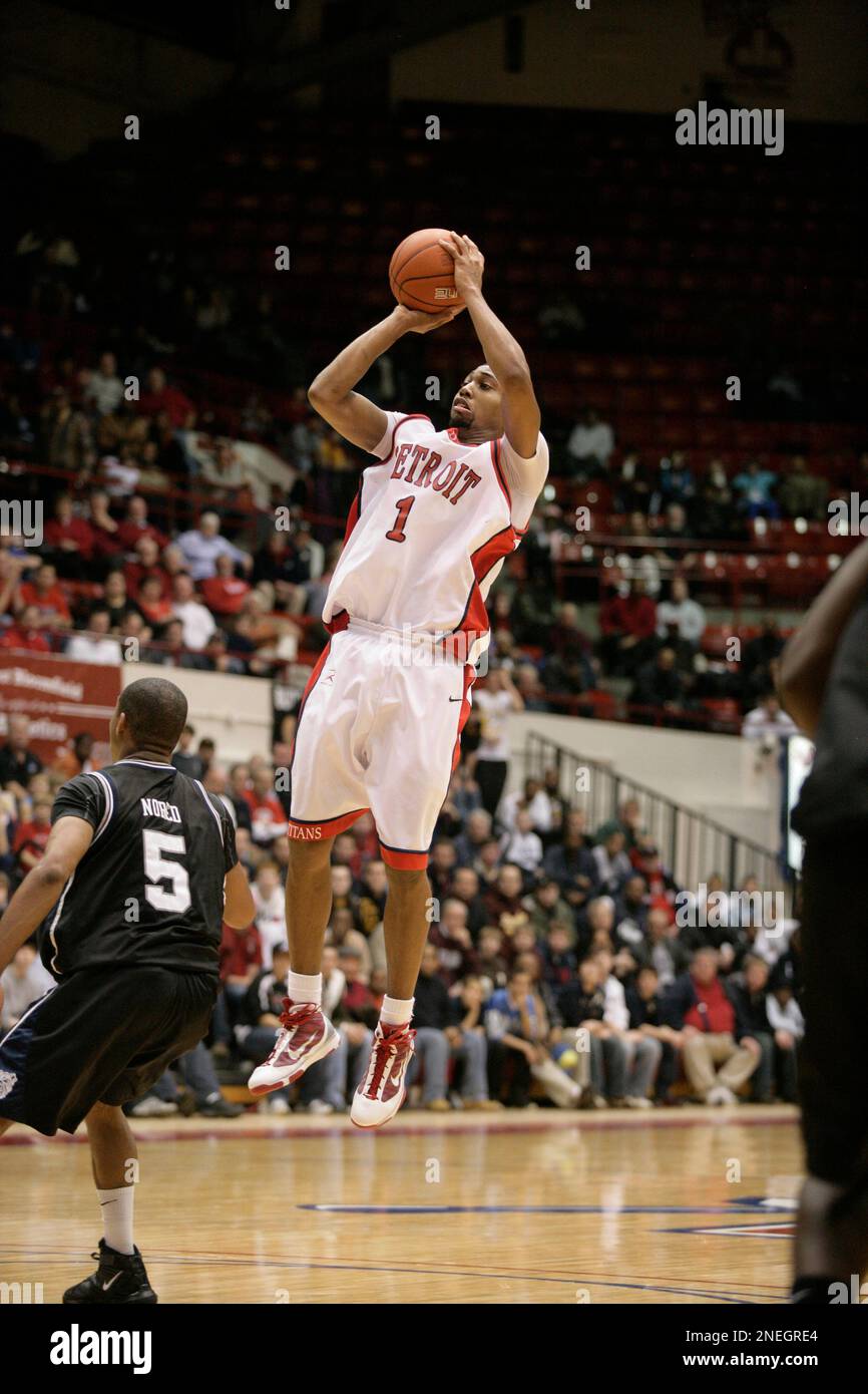Detroit guard Chase Simon (1) takes a shot over Butler guard Ronald ...