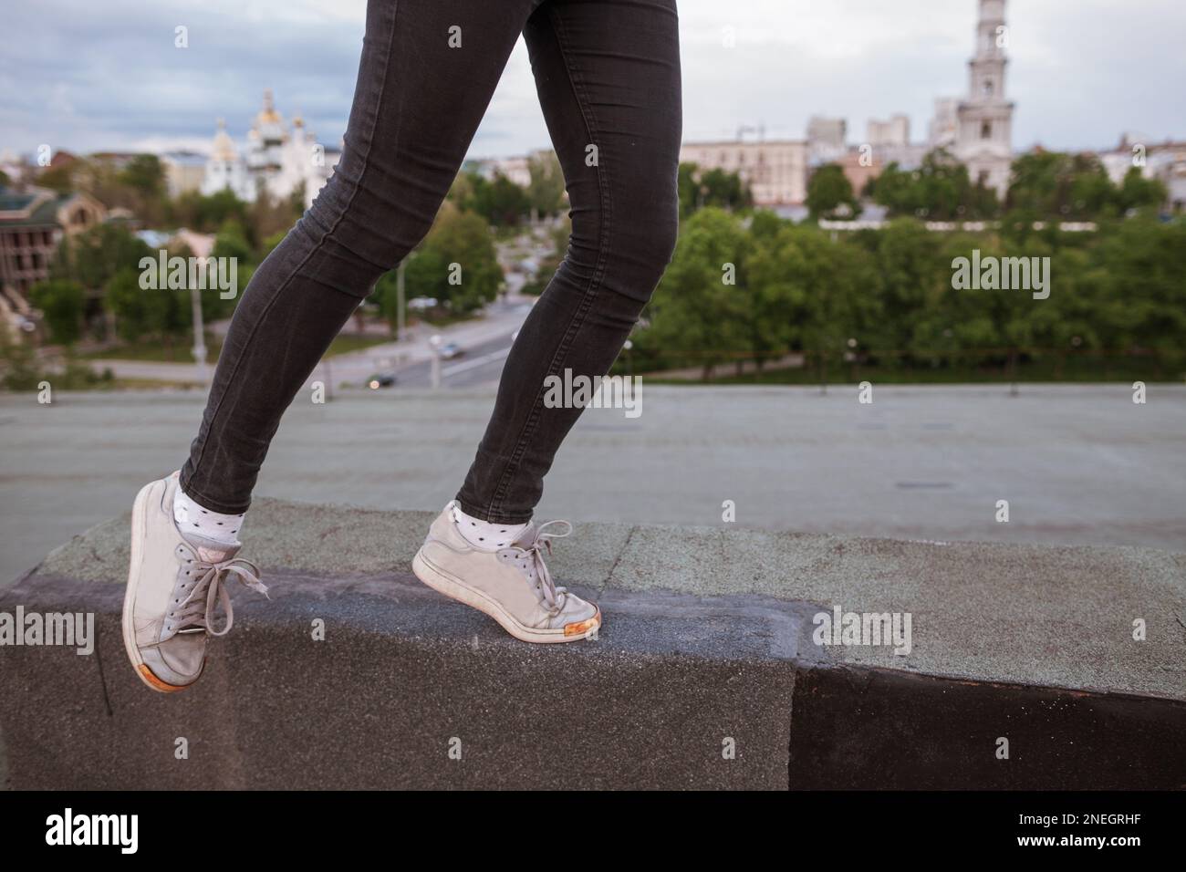 Jumping legs on urban city background Stock Photo - Alamy