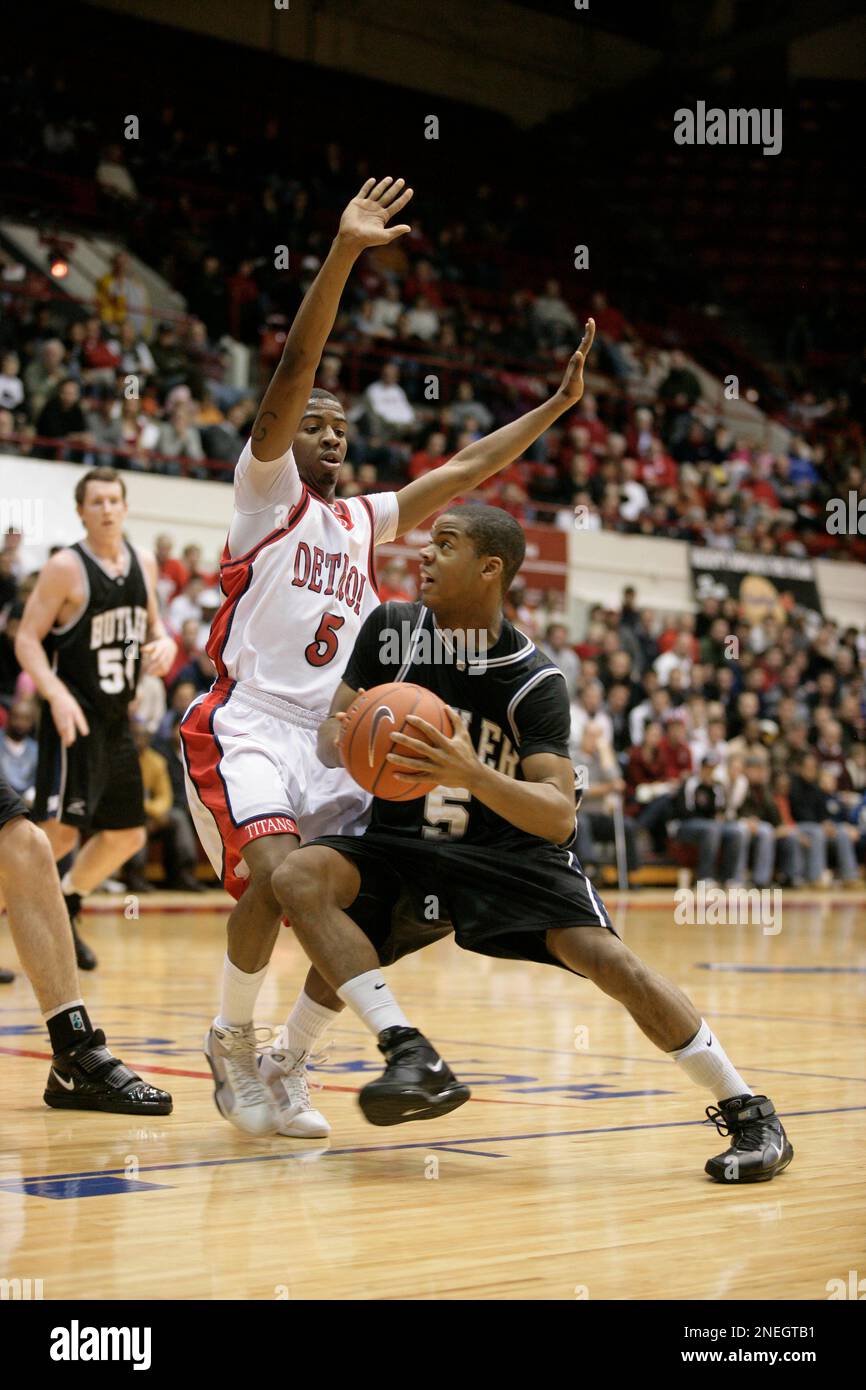 Butler guard Ronald Nored, right, drives against Detroit guard Donavan ...