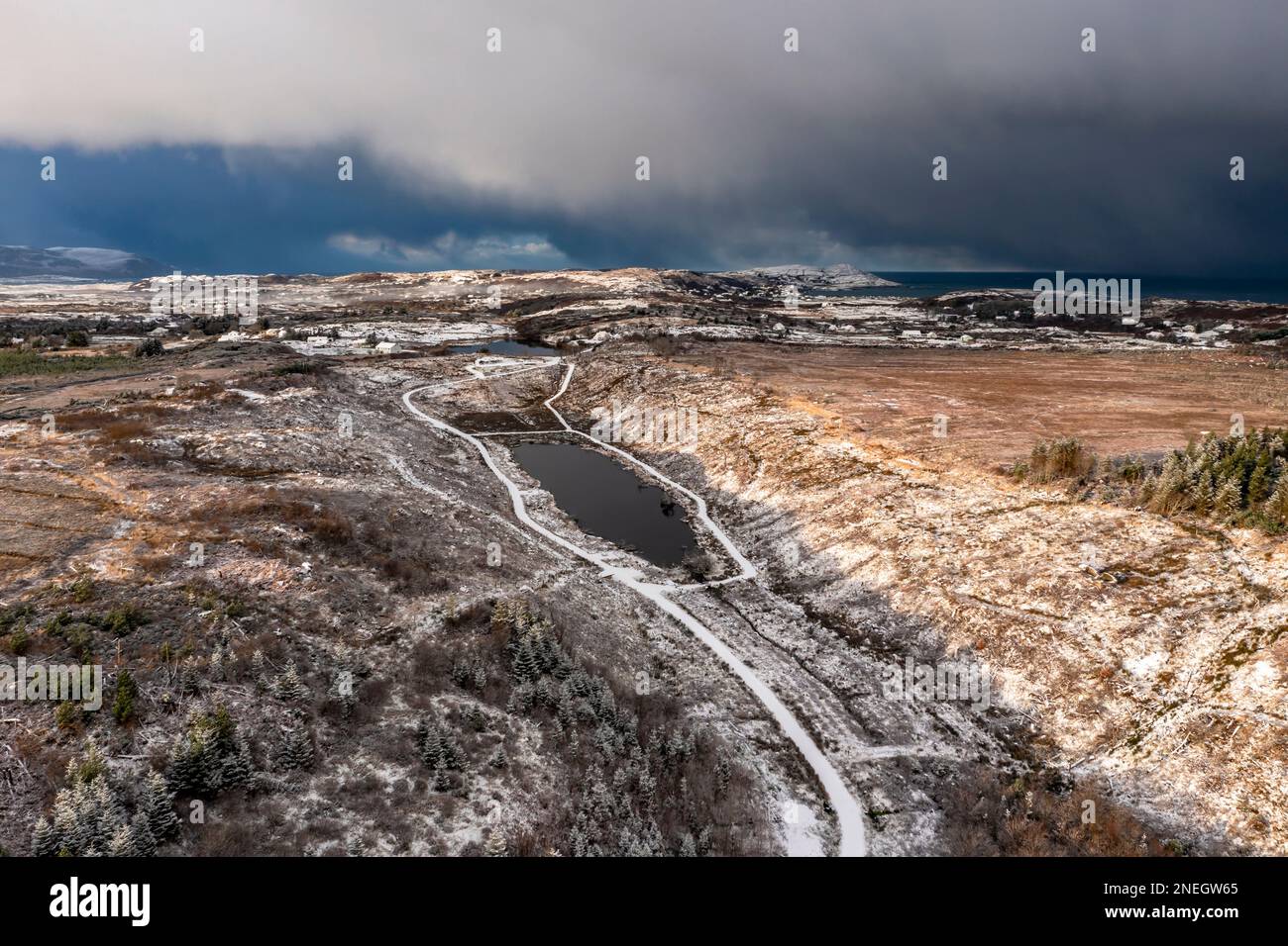 Aerial view of snow covered Bonny Glen Woods by Portnoo in County ...