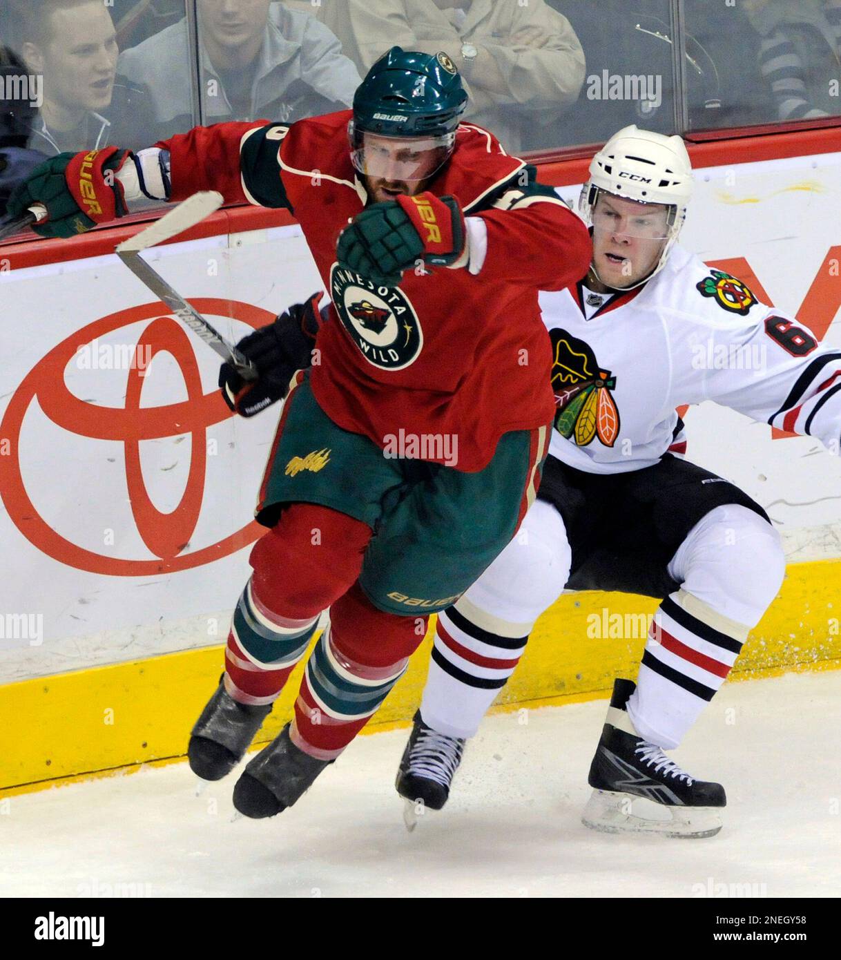 Minnesota Wild's Greg Zanon, left, tries to break away from Chicago ...