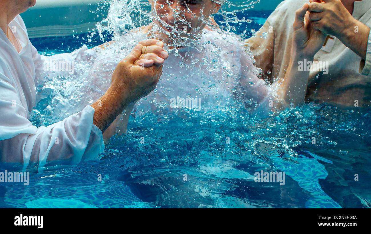 Two pastors baptize a man in the name of Christ Stock Photo - Alamy