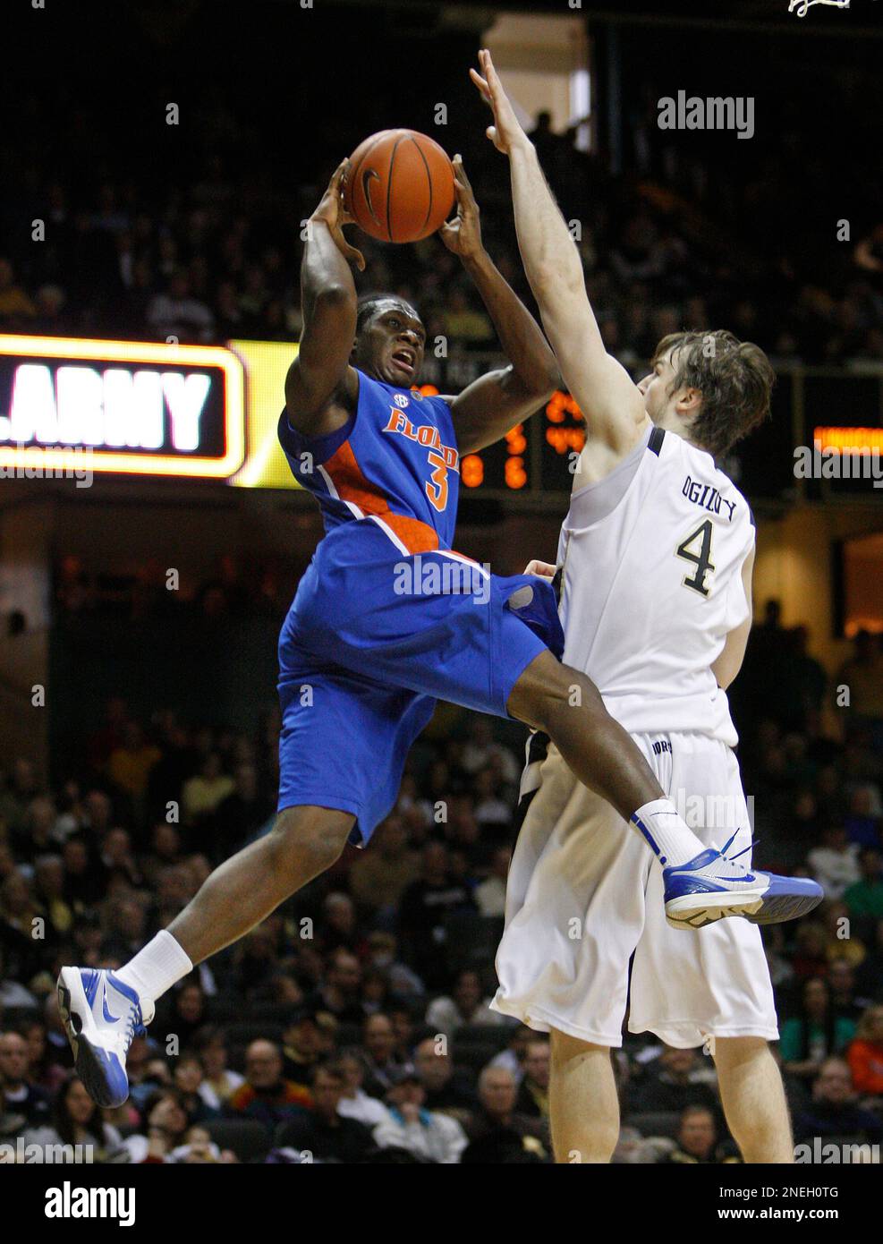 Florida's Ray Shipman (3) drives against Vanderbilt center A. J. Ogilvy ...