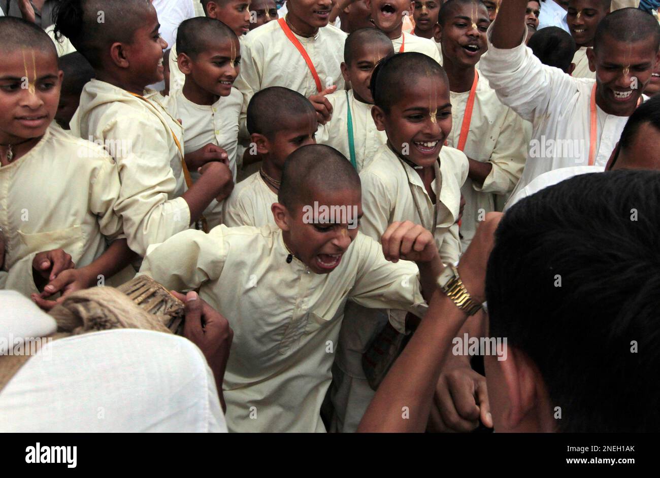 Hindu devotees dance as they chant religious verses during Lord ...