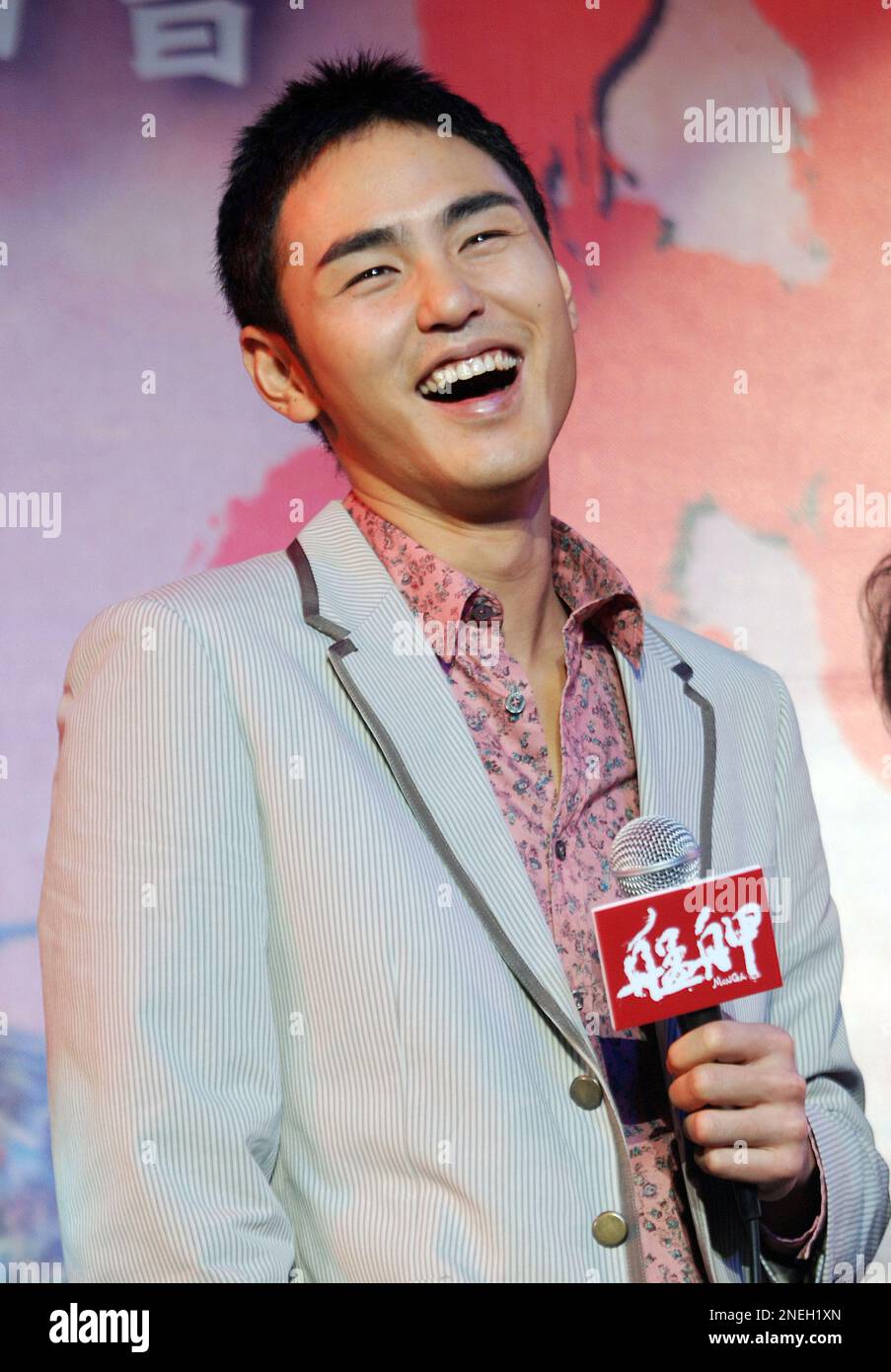 Taiwanese actor Ethan Juan laughs during a media event announcing his ...