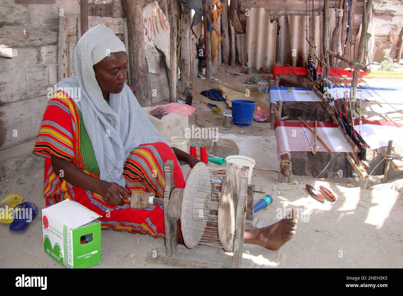 A Somali woman from the Benadiri ethnic group makes traditional cloth ...