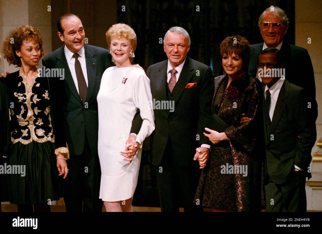 American singer Frank Sinatra, center, is framed by (from left) Paris ...