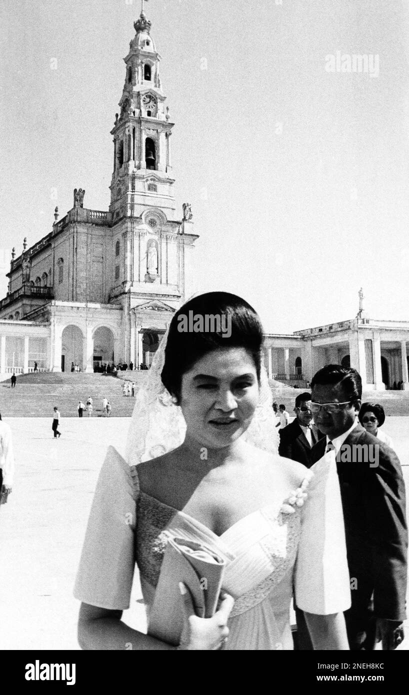 Mrs. Imelda Marcos, wife of the Philippine President, praying at the ...