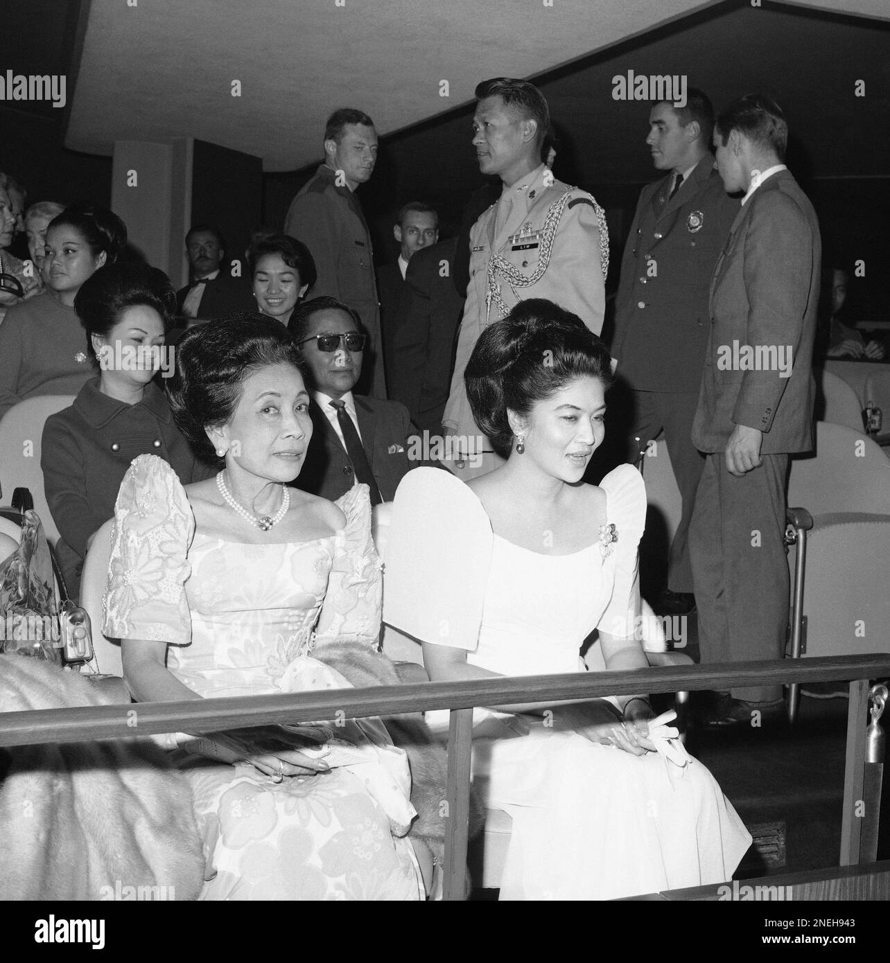 Mrs. Ferdinand Marcos, first lady of the Philippines, is seated in the ...
