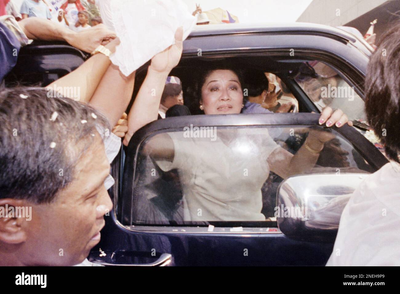 Former Philippine First Lady Imelda Marcos waves her handkerchief to ...