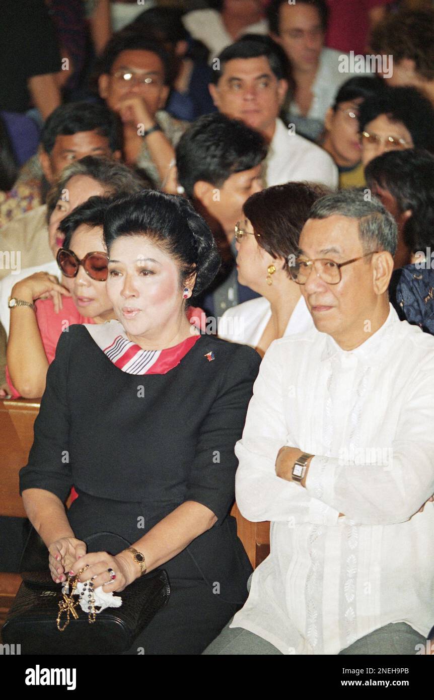 Former Philippine First Lady Imelda Marcos, left, with rosary in hand ...