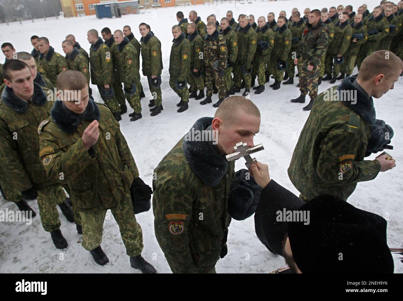 Servicemen of the Belarussian Interior Ministry's special unit kiss an ...