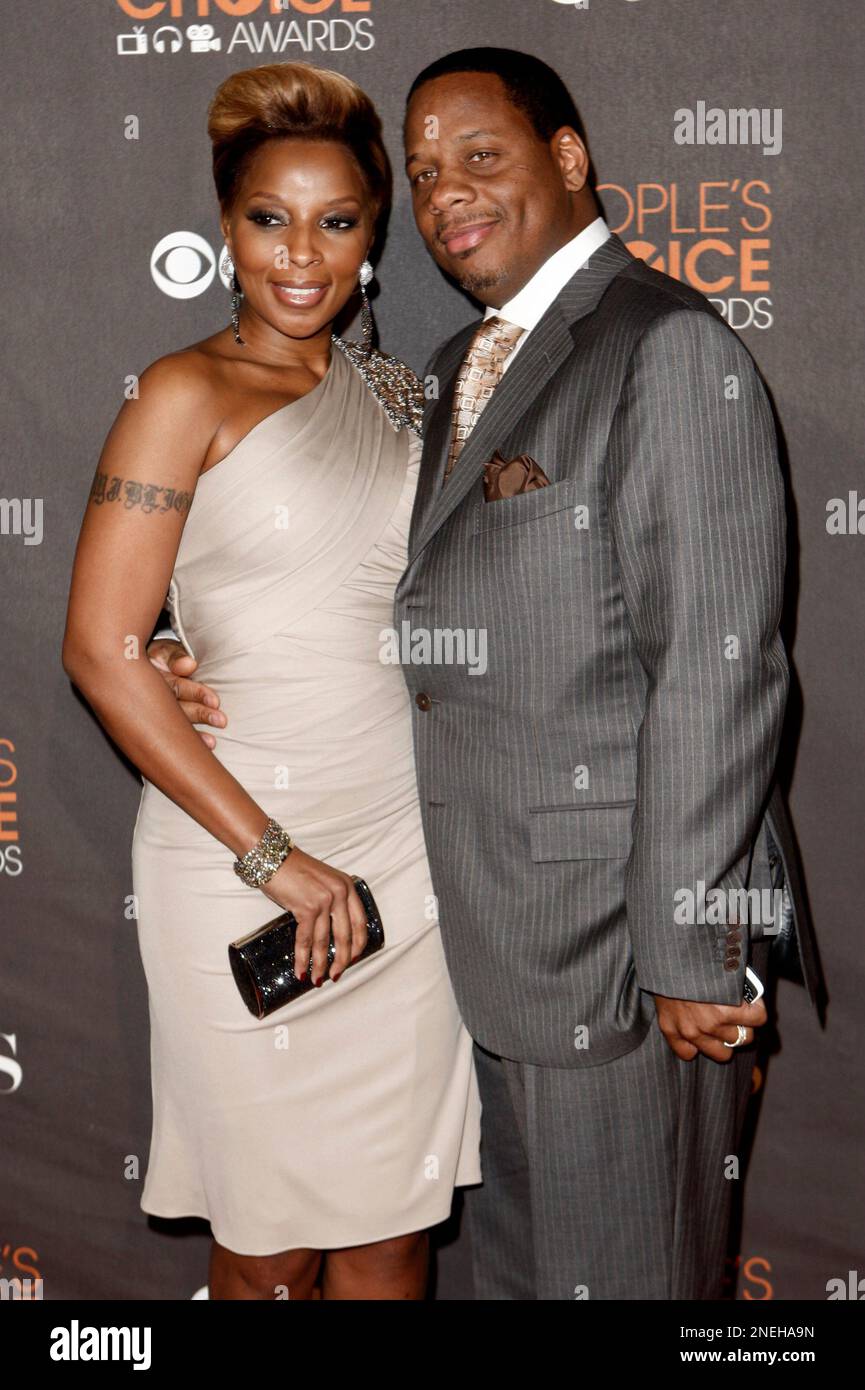 Mary J. Blige, left, and husband Kendu Isaacs arrive at the People's Choice Awards on Wednesday ...