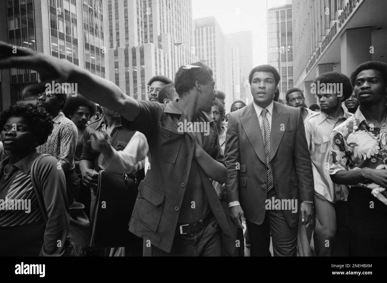 Heavyweight champ Muhammad Ali walks along 6th Avenue in New York City ...