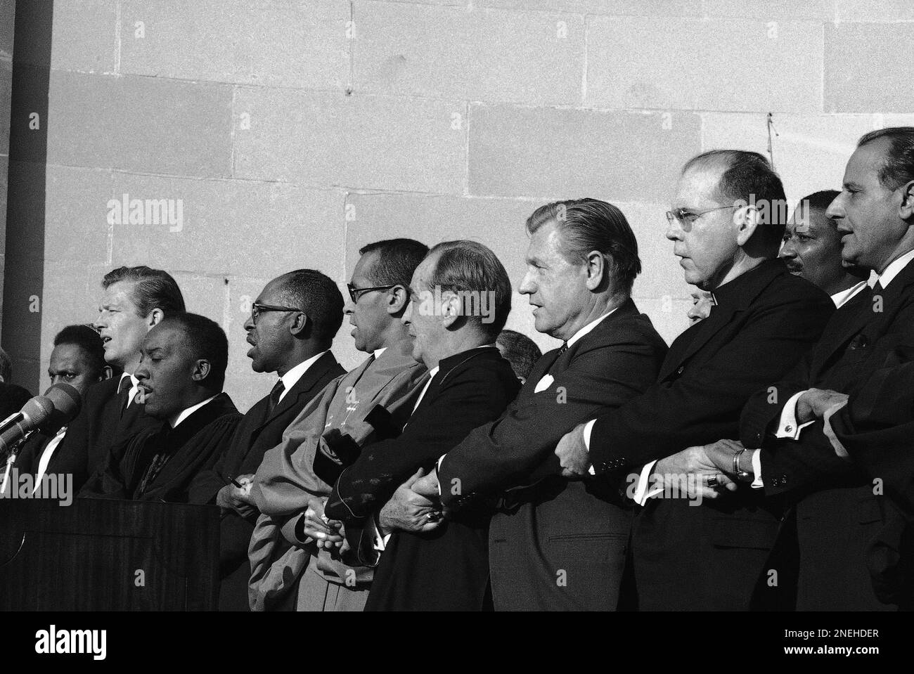 "We Shall Overcome" is sung by dignitaries during memorial service to ...