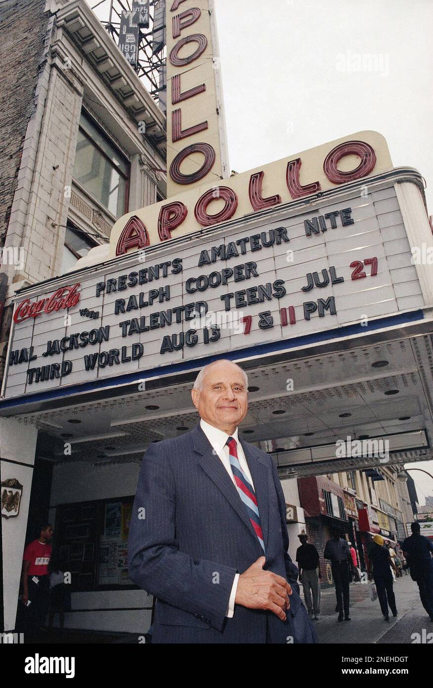Percy Sutton poses in front of the Apollo Theater on 125th Street in ...