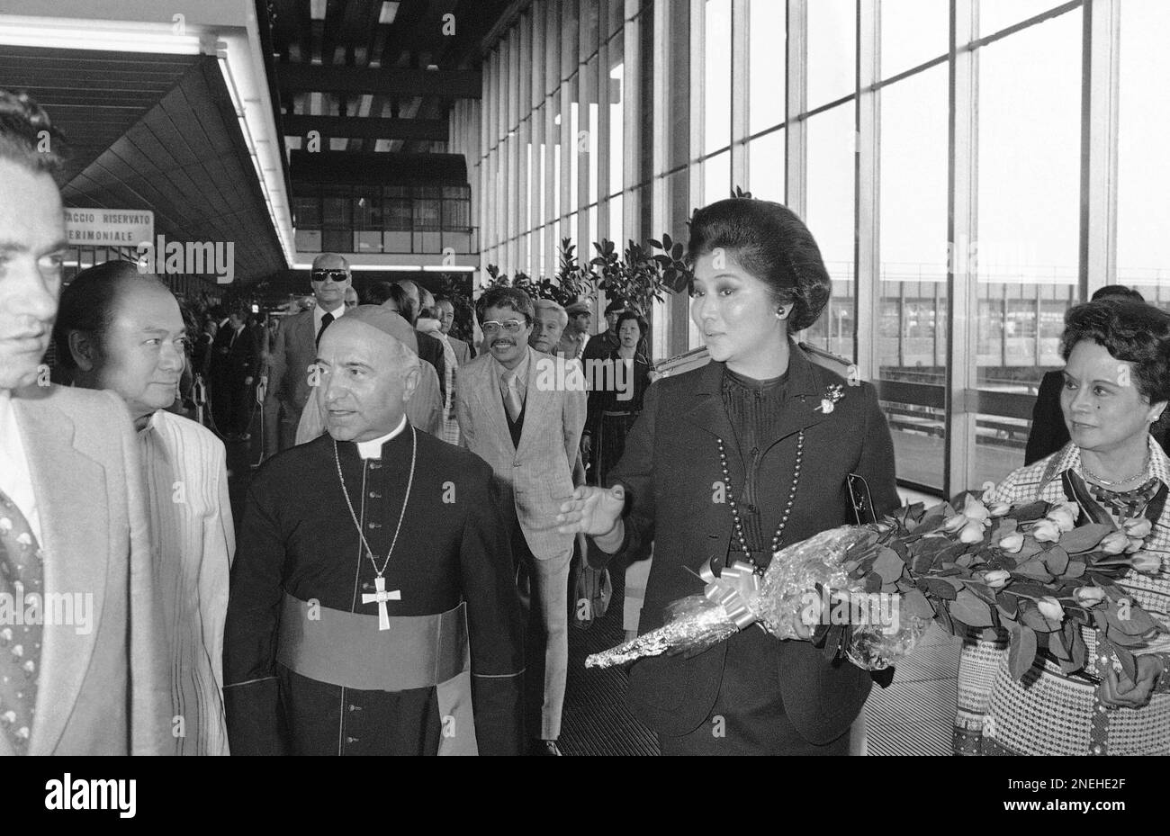 Mrs. Imelda Marcos, wife of Philippine President, wears a bunch of ...