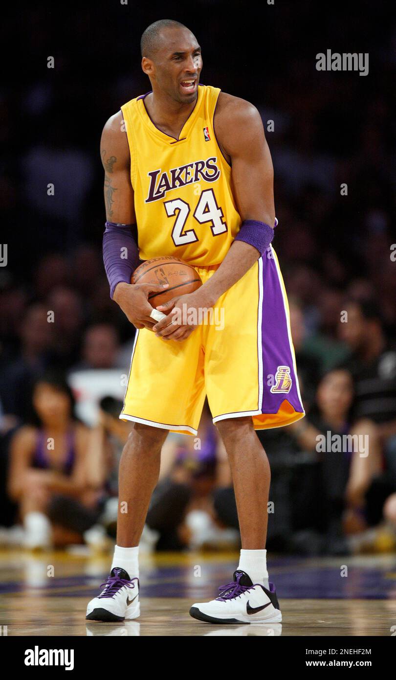 Los Angeles Lakers guard Kobe Bryant grabs his right index finger after ...