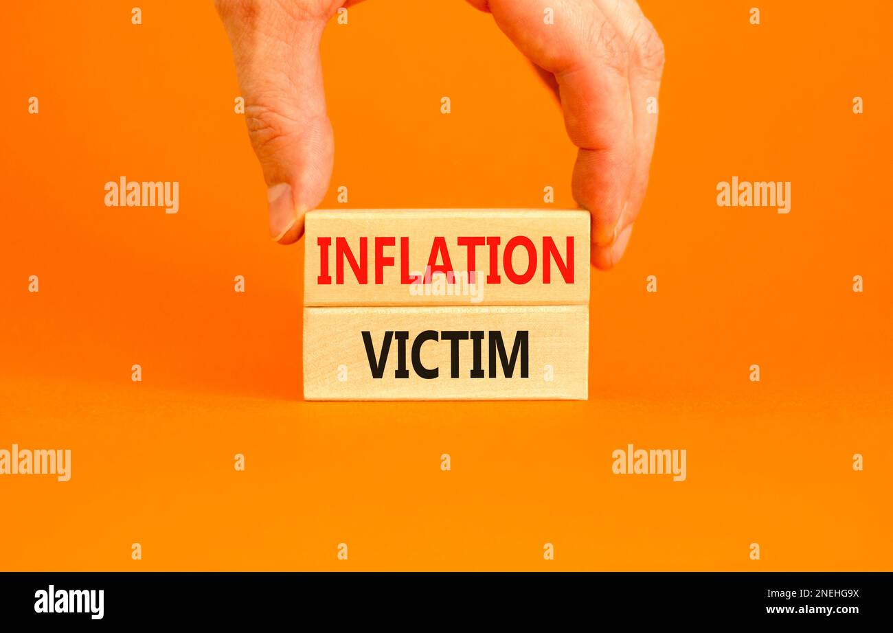 Inflation victim symbol. Concept words Inflation victim on wooden block ...