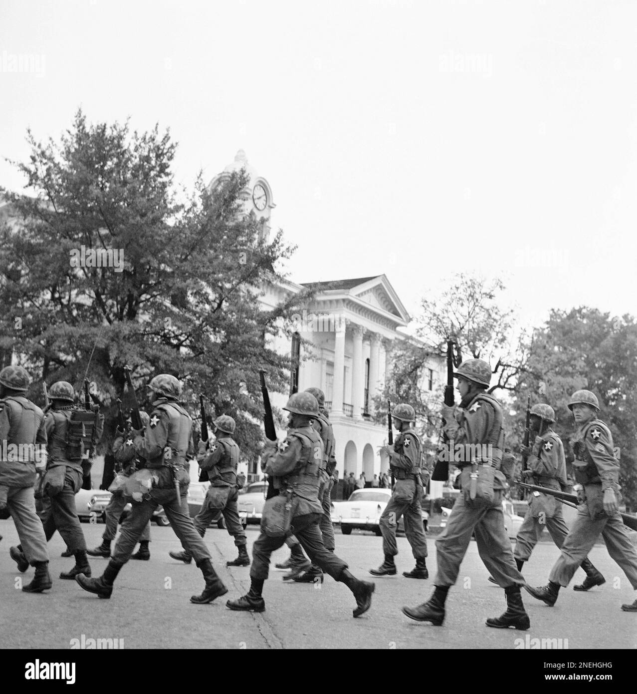 Army troops patrol past the famed courthouse square in downtown Oxford ...