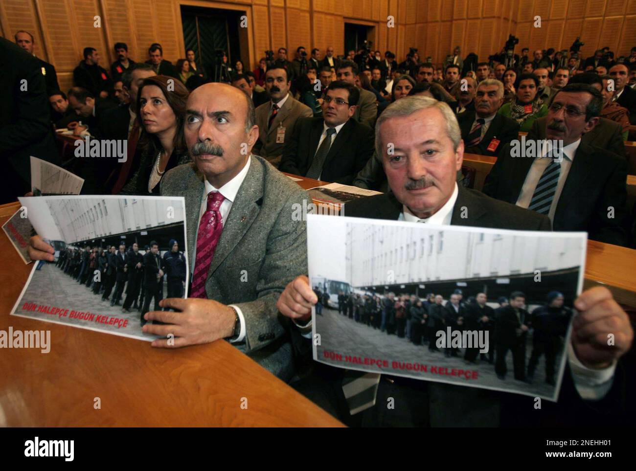 Pro-Kurdish lawmakers hold pictures of Kurdish politicians as they were ...
