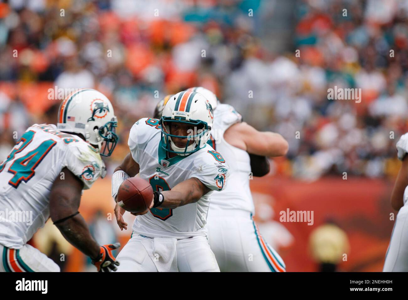 Miami Dolphins quarterback Pat White hands off to running back Ricky ...