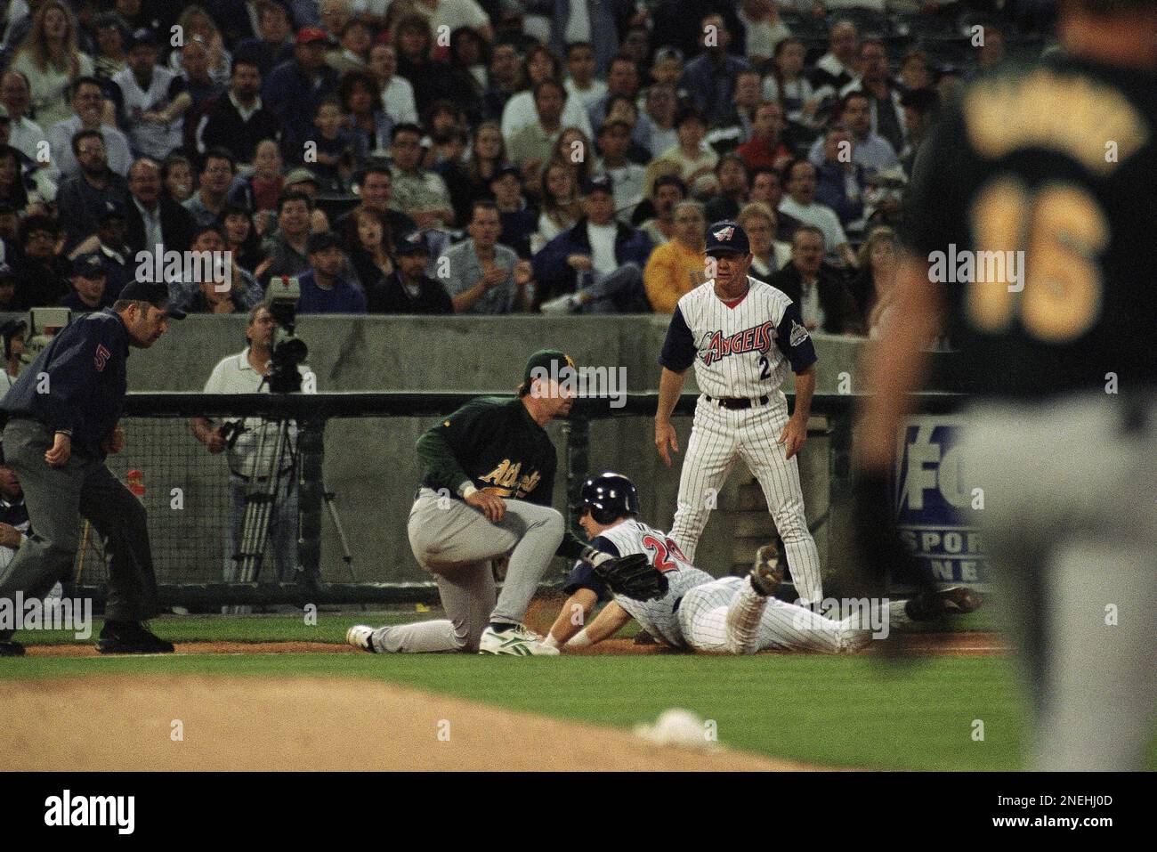 Anaheim Angels? Phil Nevin slides safely into third base ahead of the ...