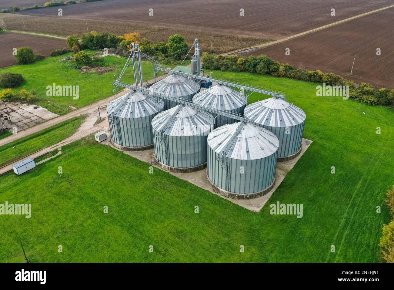 Agricultural silos on the farm in autumn, close-up drone view ...