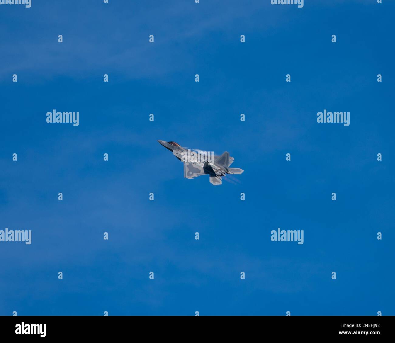 A F-22 Raptor shows off its skills in an aerial acrobatic demonstration ...