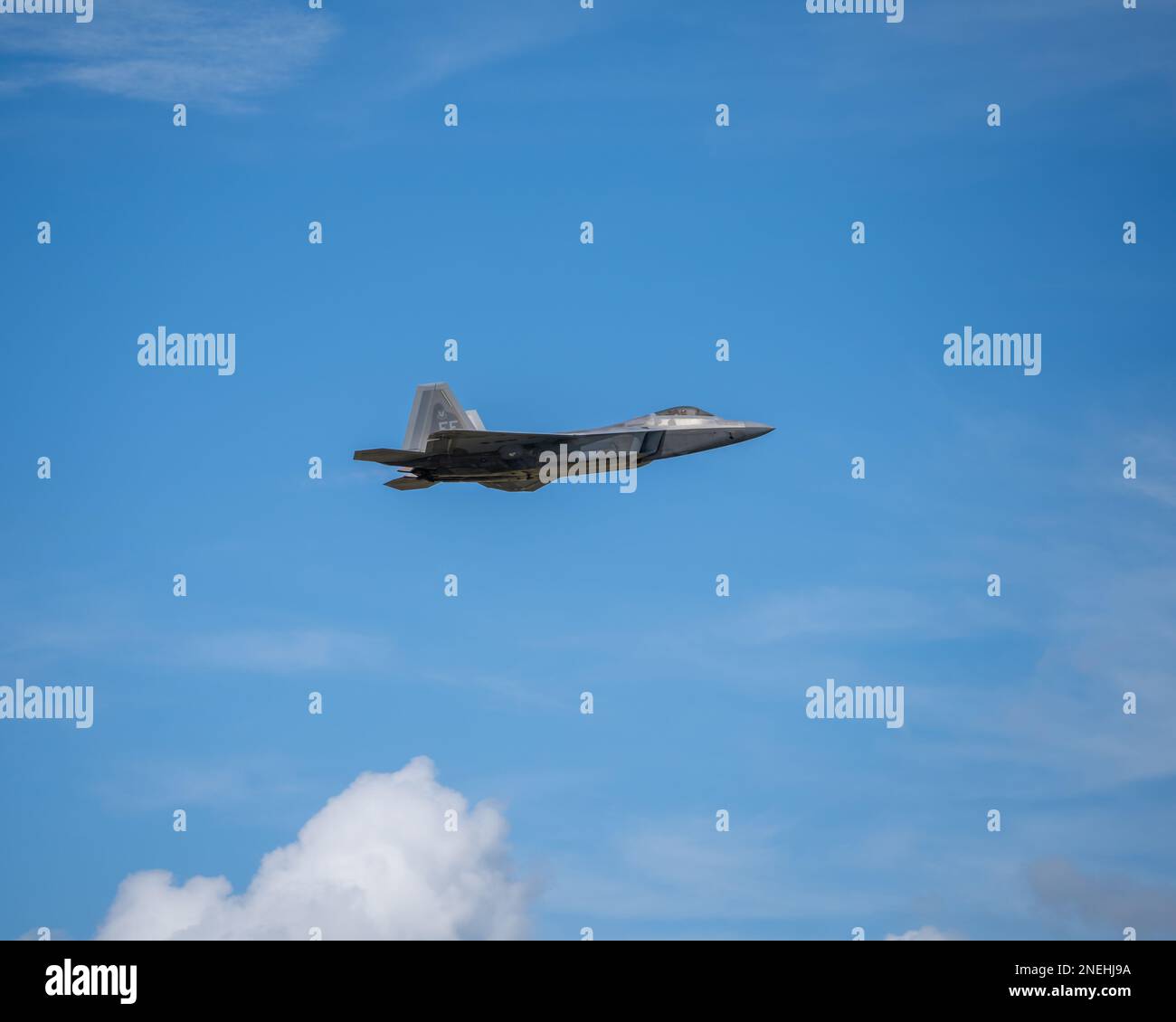 A F-22 Raptor shows off its skills in an aerial acrobatic demonstration ...