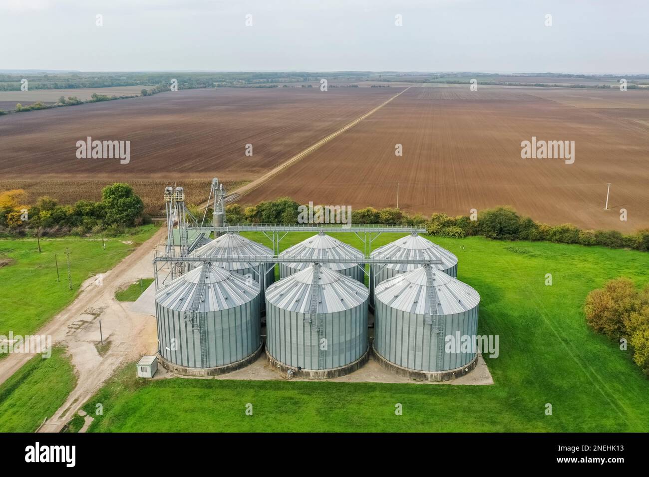 Agricultural silos on the farm in autumn, close-up drone view ...