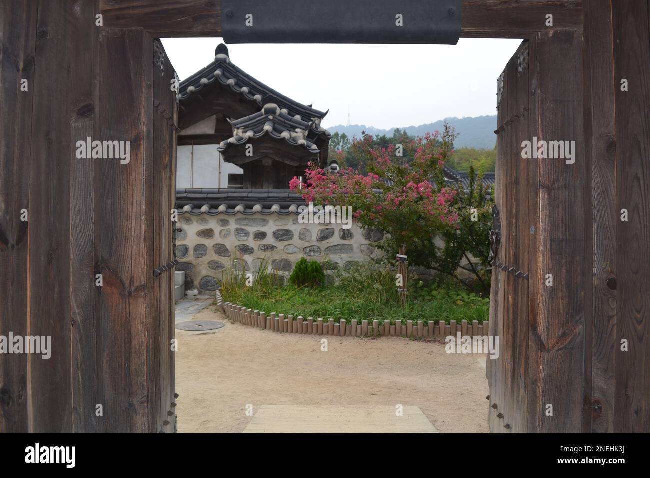 The open wooden doors of a traditional house at Namsangol Hanok Village ...