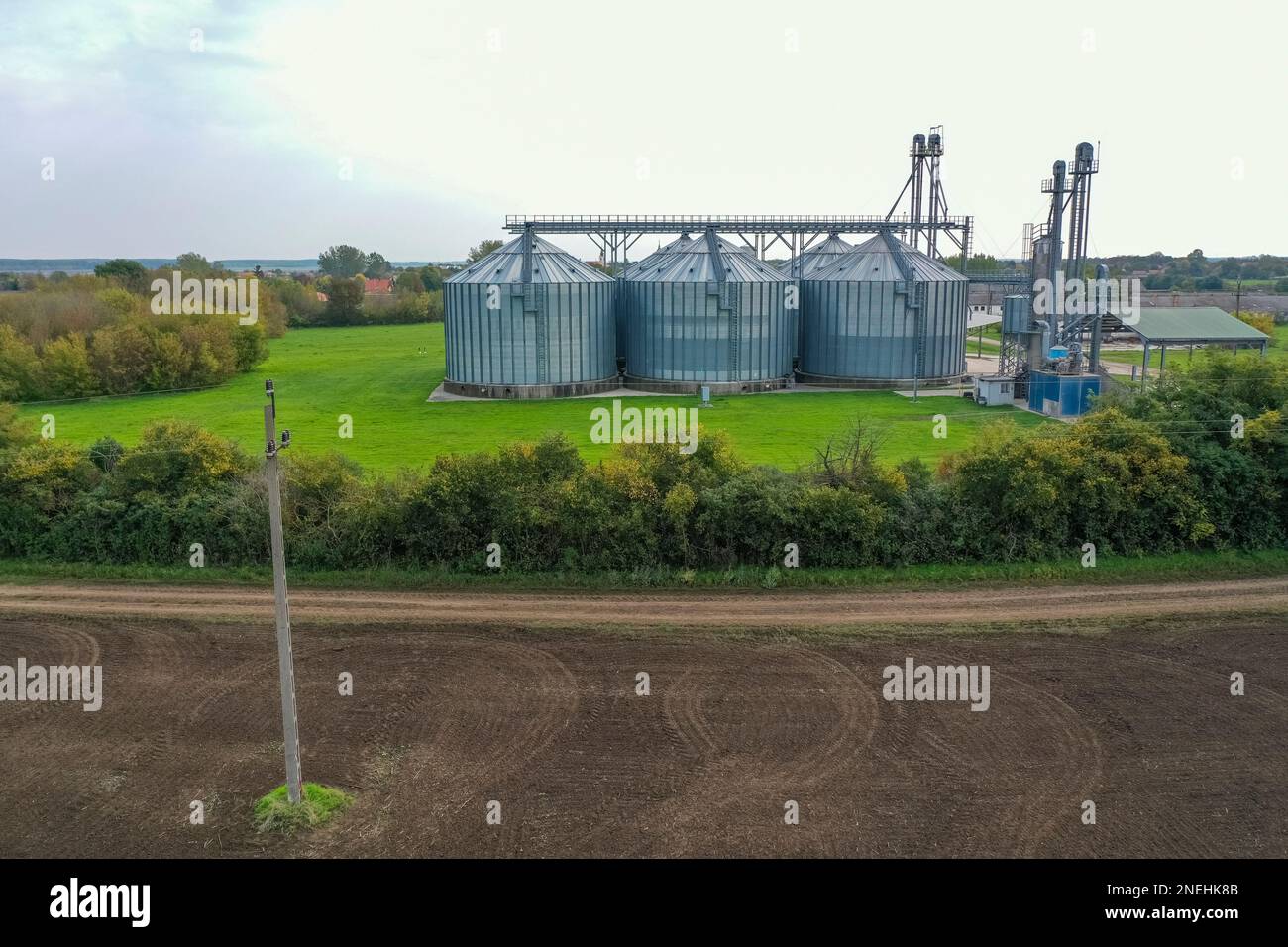 Agricultural silos on the farm in autumn, close-up drone view ...