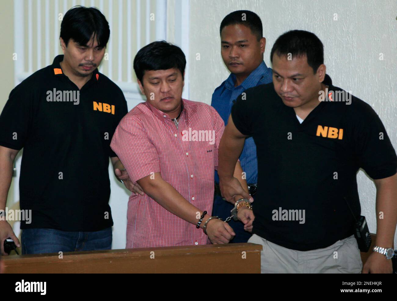 Andal Ampatuan Jr., center, the prime suspect in the massacre of 57 ...