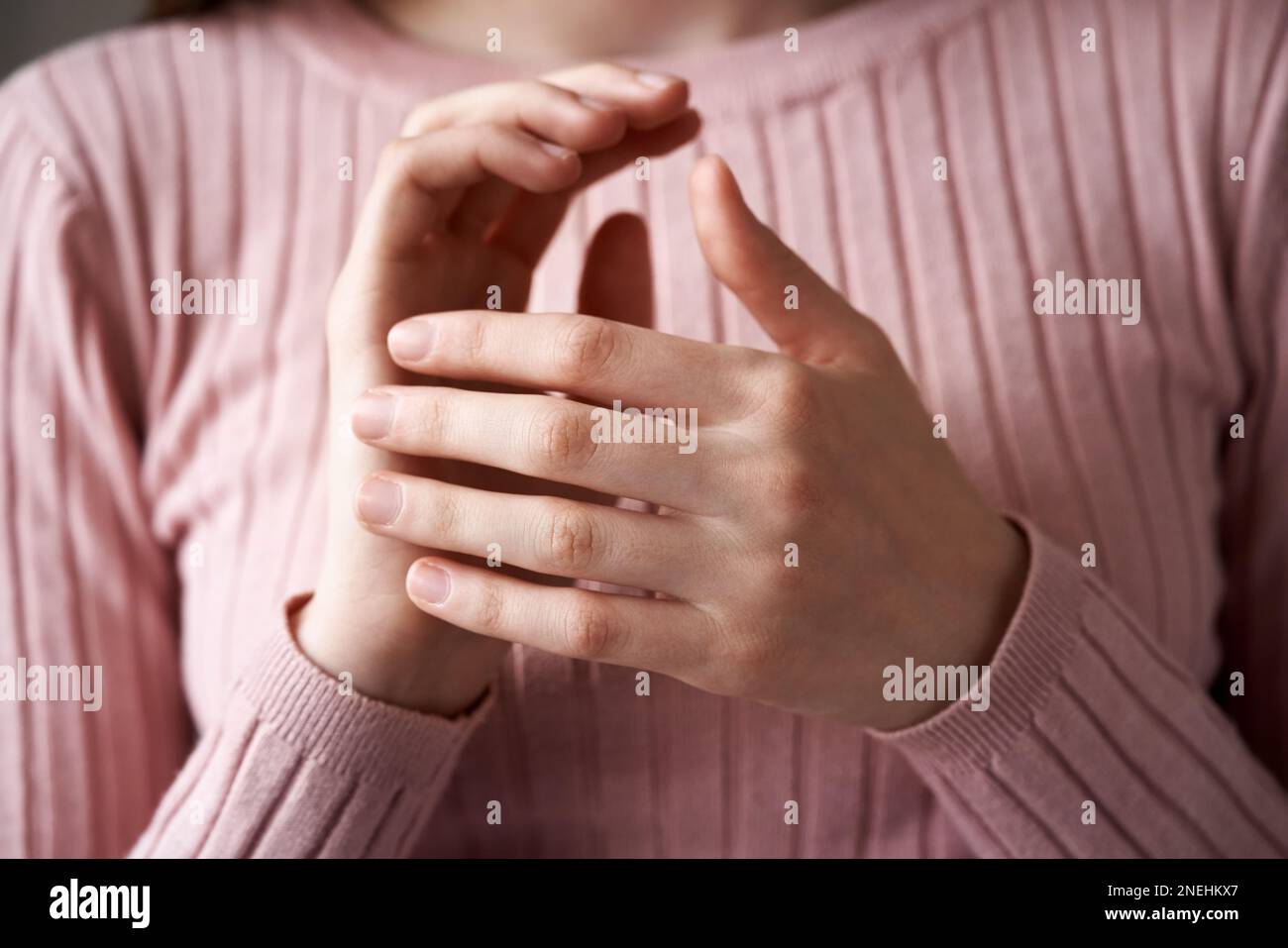 Woman tapping on the side of the hand - practicing EFT or emotional ...